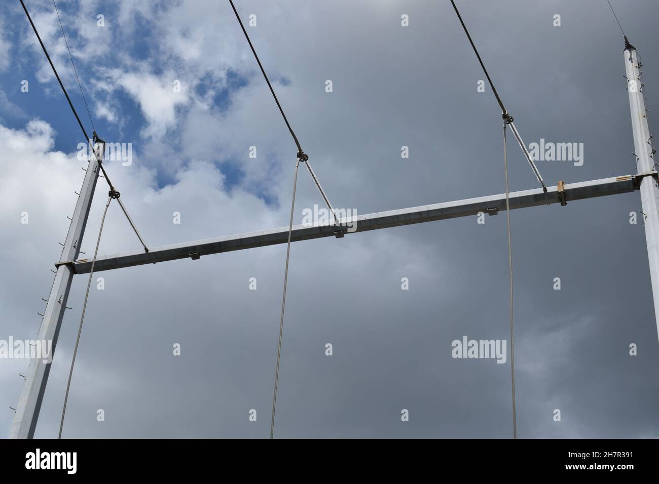 High power lines directly overhead connect to the grid Stock Photo - Alamy