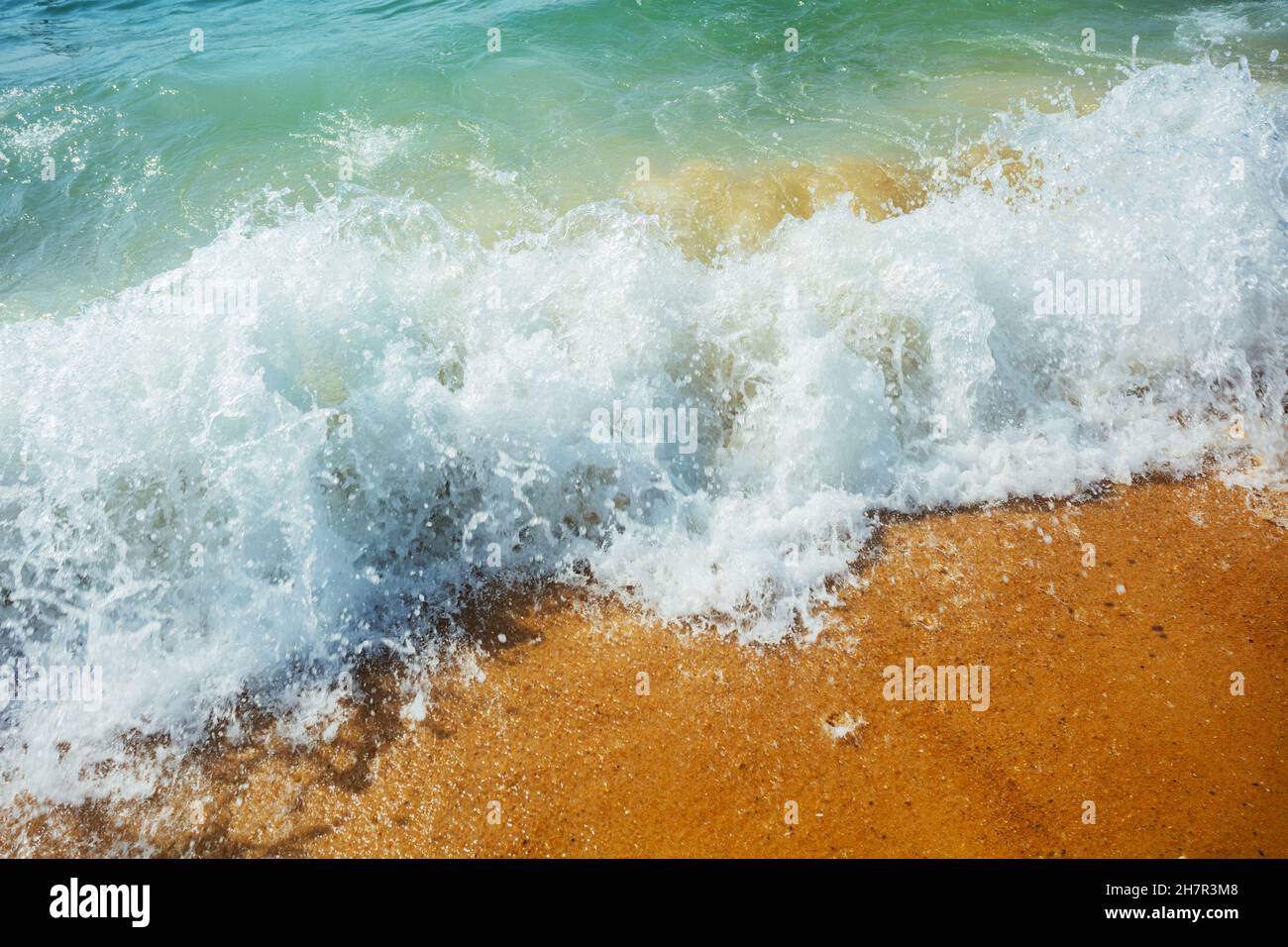 Sea foam on the sand beach with summer sunlight Stock Photo - Alamy