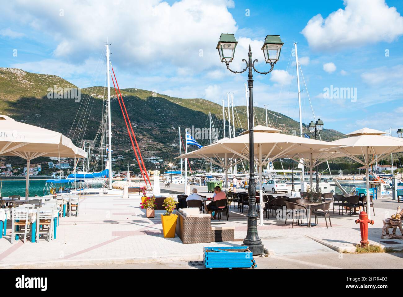 cafe at greek town harbor boats and ships Stock Photo - Alamy