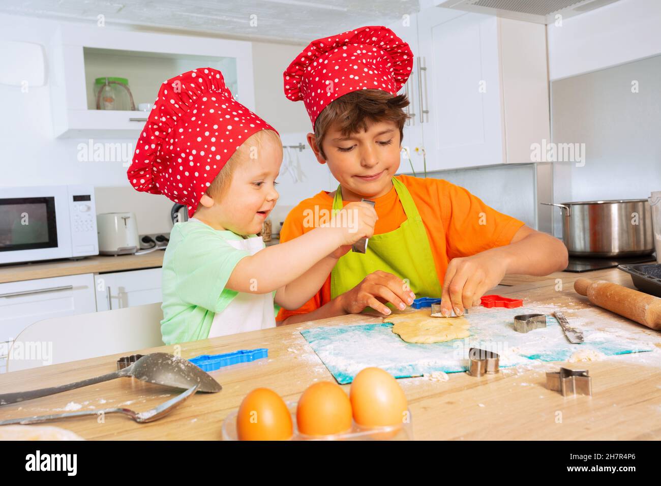 Boy cutting out cookies hi-res stock photography and images - Alamy