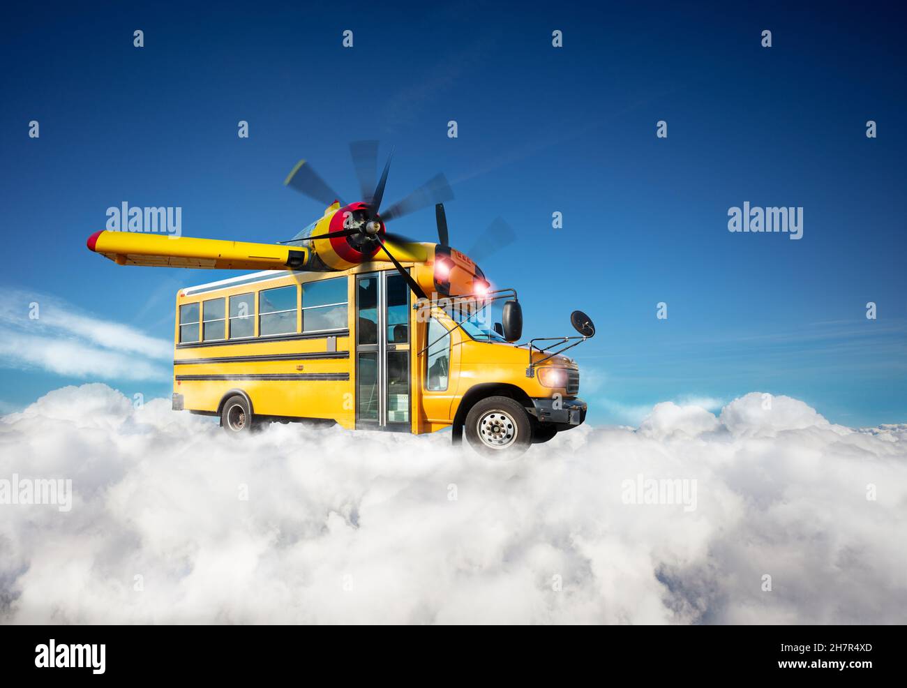 School bus as plain flying high in the clouds sky Stock Photo - Alamy