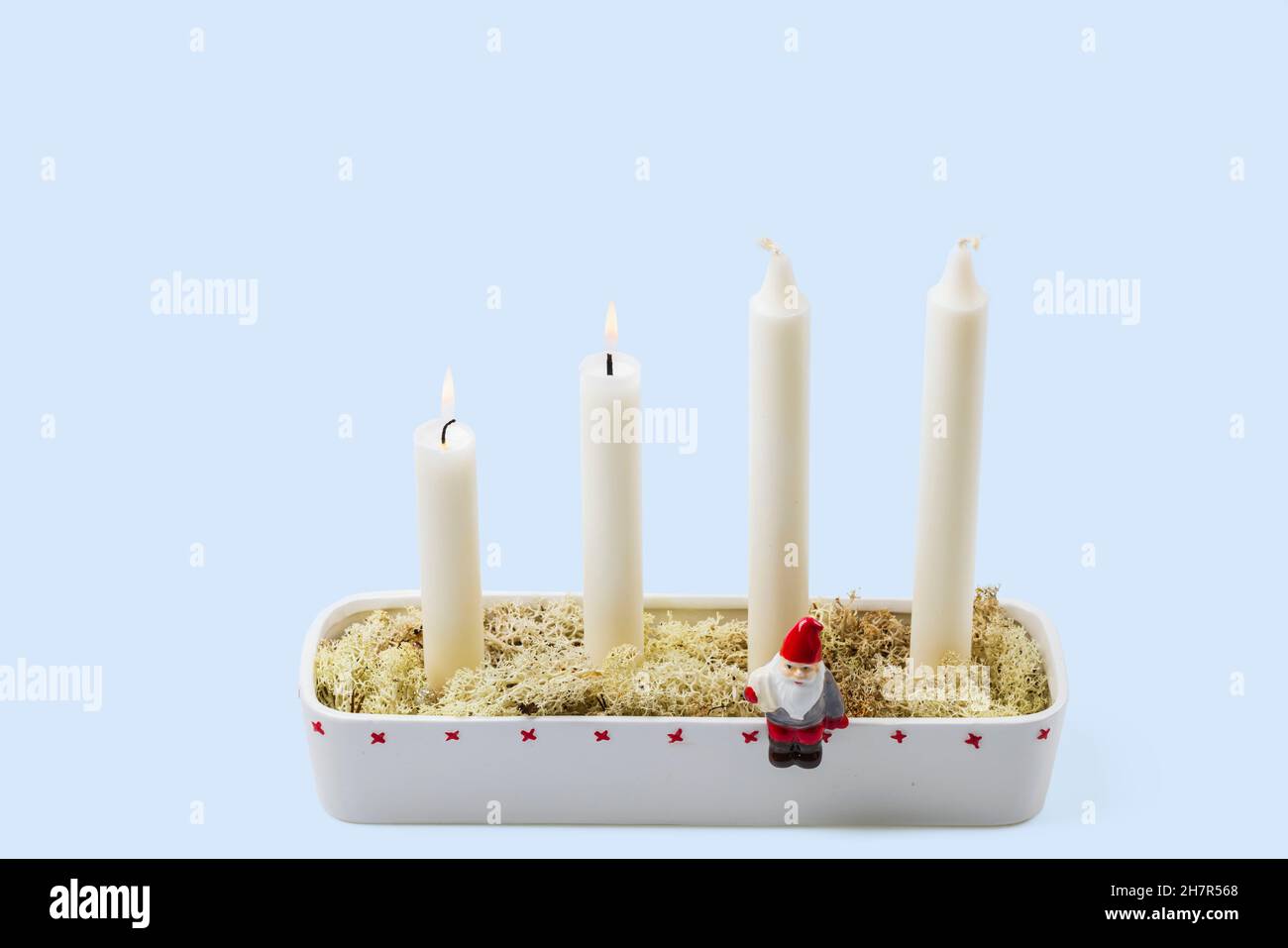 Beautiful view of white candles in traditional advent candlestick ...