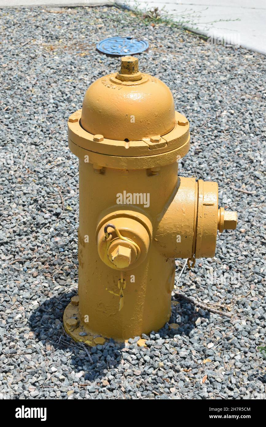Side view of bright yellow fire hydrant Stock Photo - Alamy