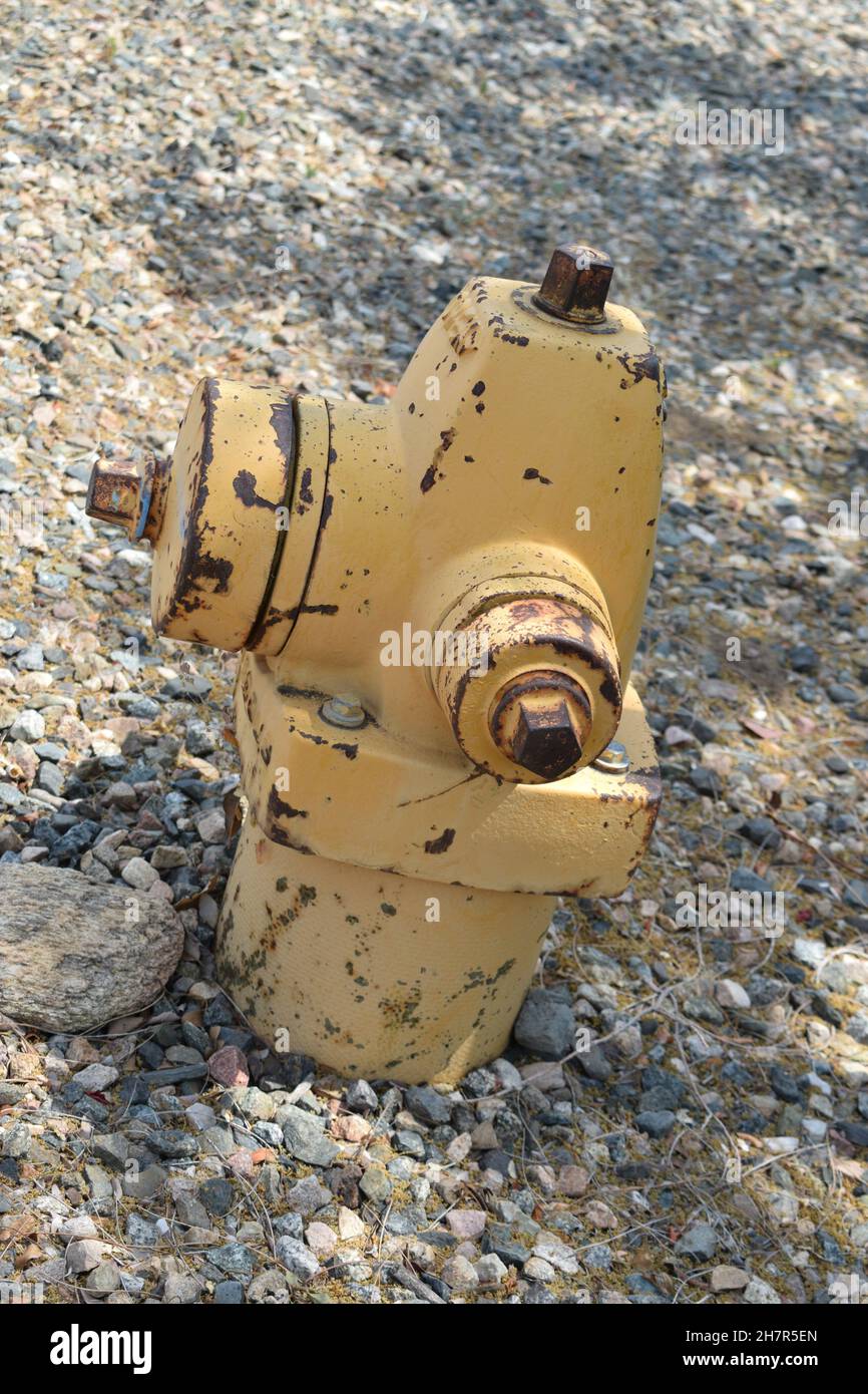 Side view of old rusted yellow fire hydrant Stock Photo - Alamy