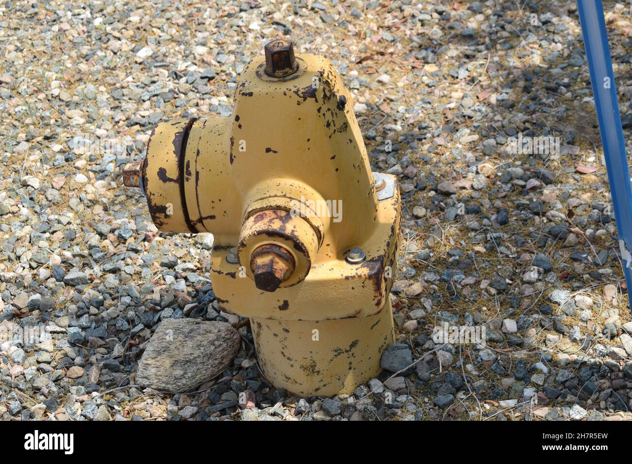 Back view of old rusted yellow fire hydrant Stock Photo - Alamy