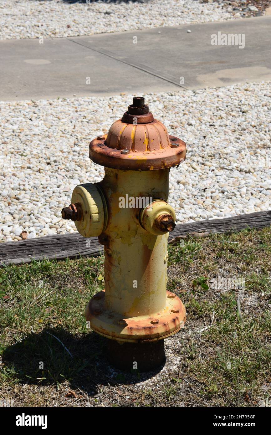An old style fire hydrant is worn and rusted Stock Photo - Alamy