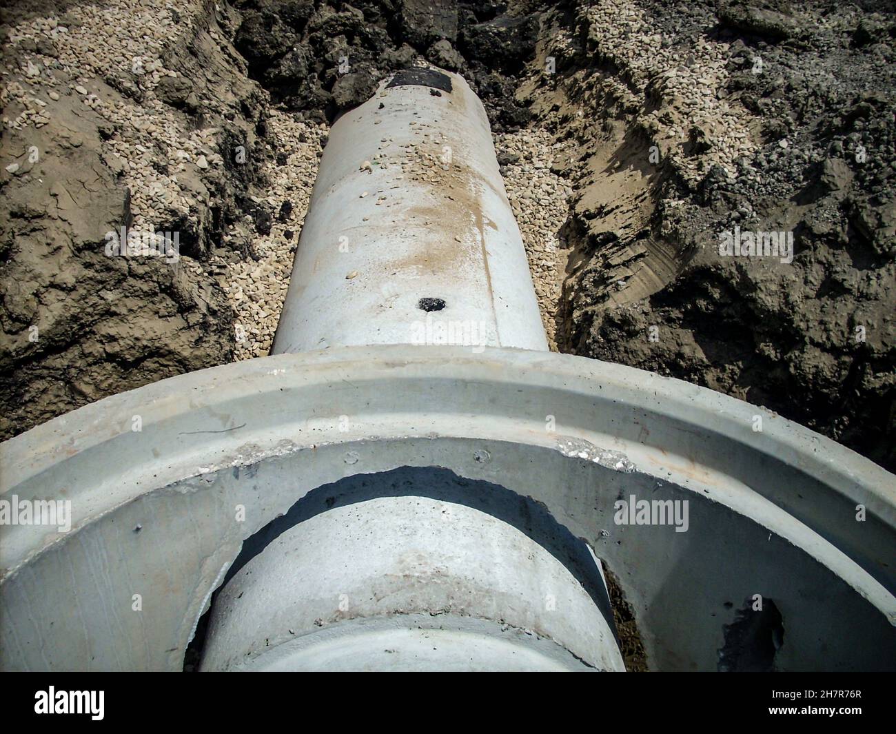 Precast concrete manhole with pass through pipe connections Stock Photo ...