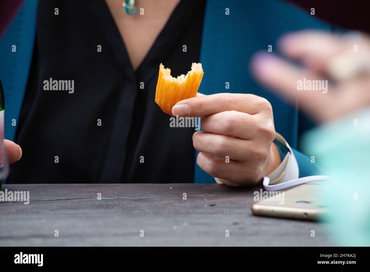 Obese woman eating dumpling. person holding sweets in hand Stock Photo ...