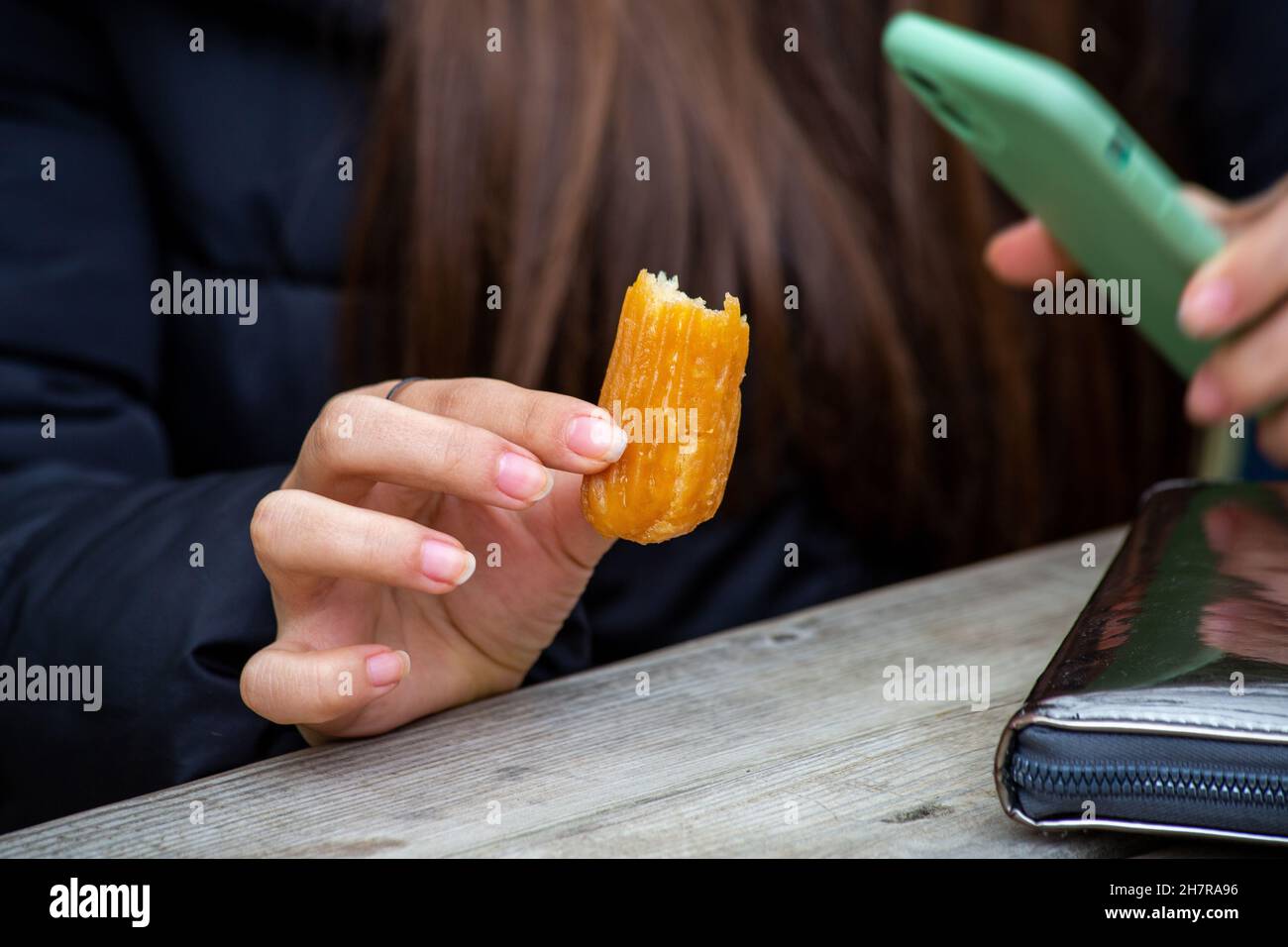 Obese woman eating dumpling. person holding sweets in hand Stock Photo ...