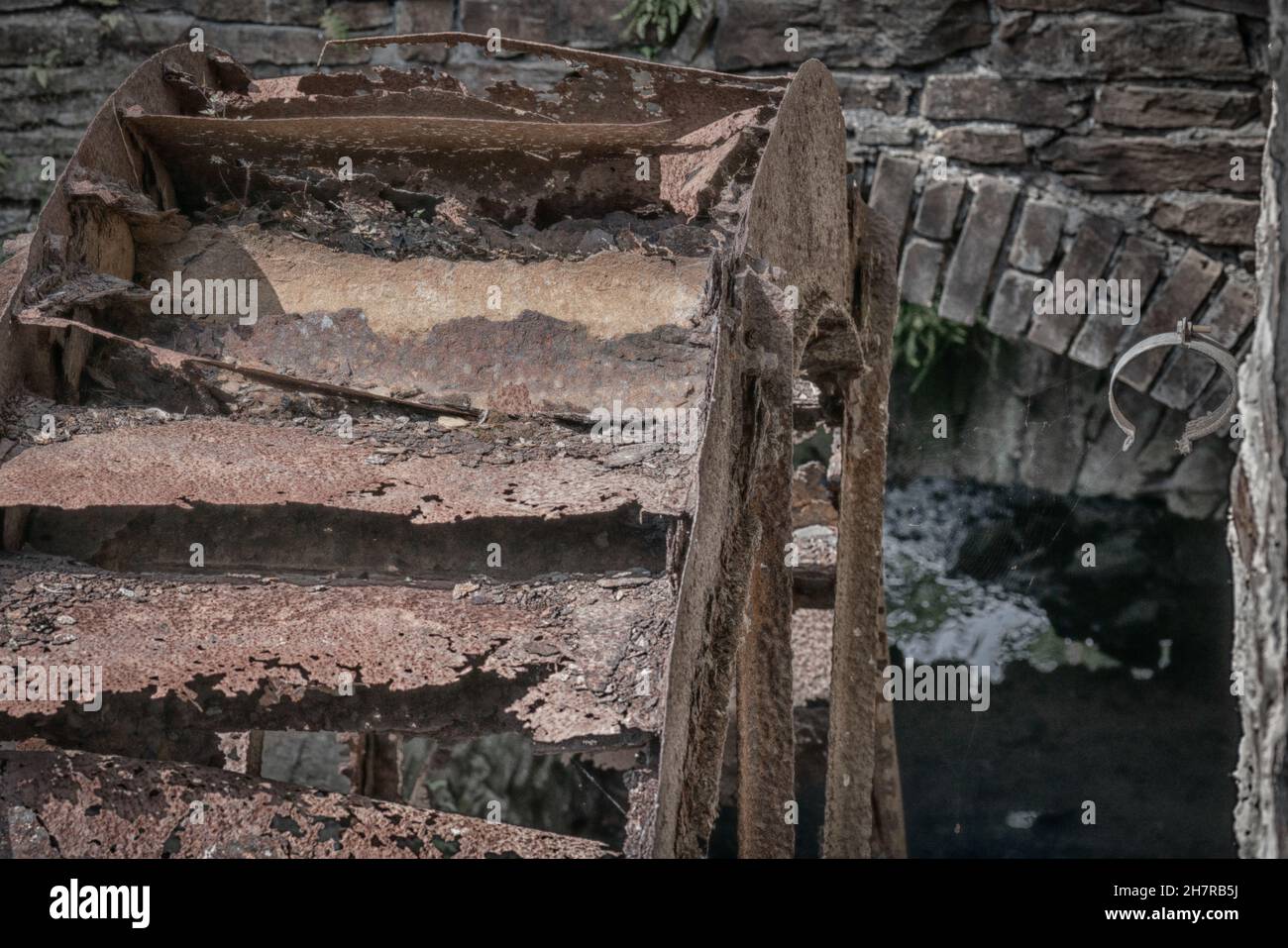 Rusty mill wheel in its traditional place in cutout. Close-up Stock ...