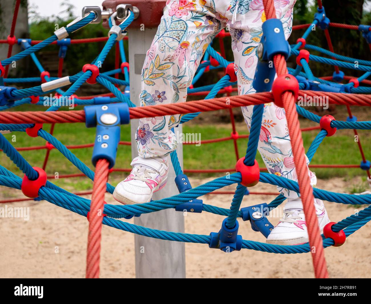 Anonymous child, active elementary school age girl climbing, walking on ...