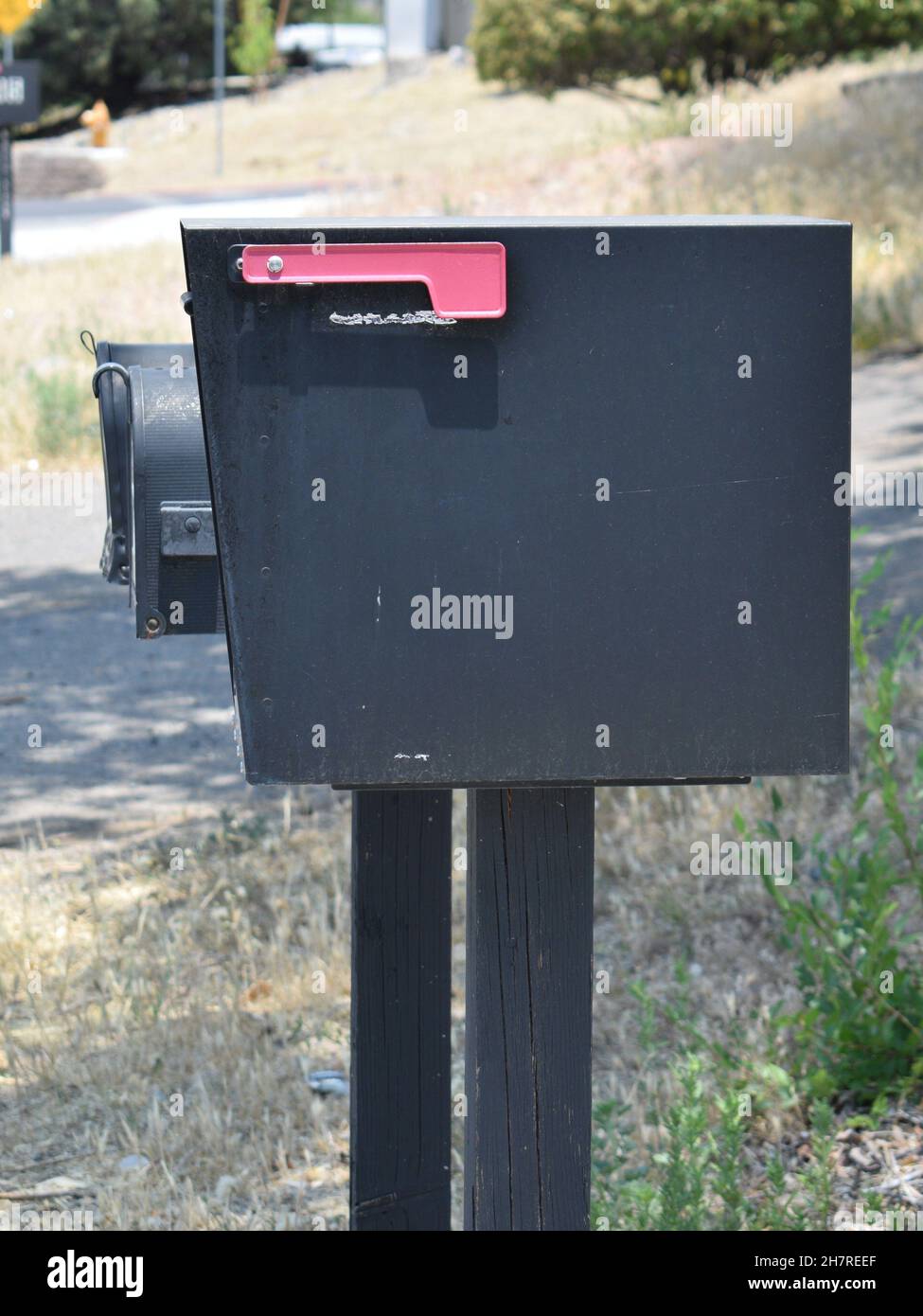 Side view of large black rural mailbox Stock Photo - Alamy