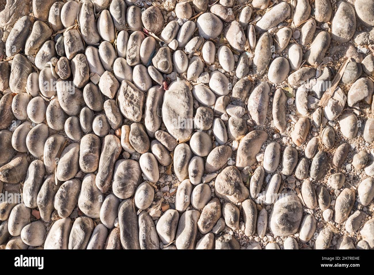 White pebble in concrete path. Top view stone background. Seaside ...