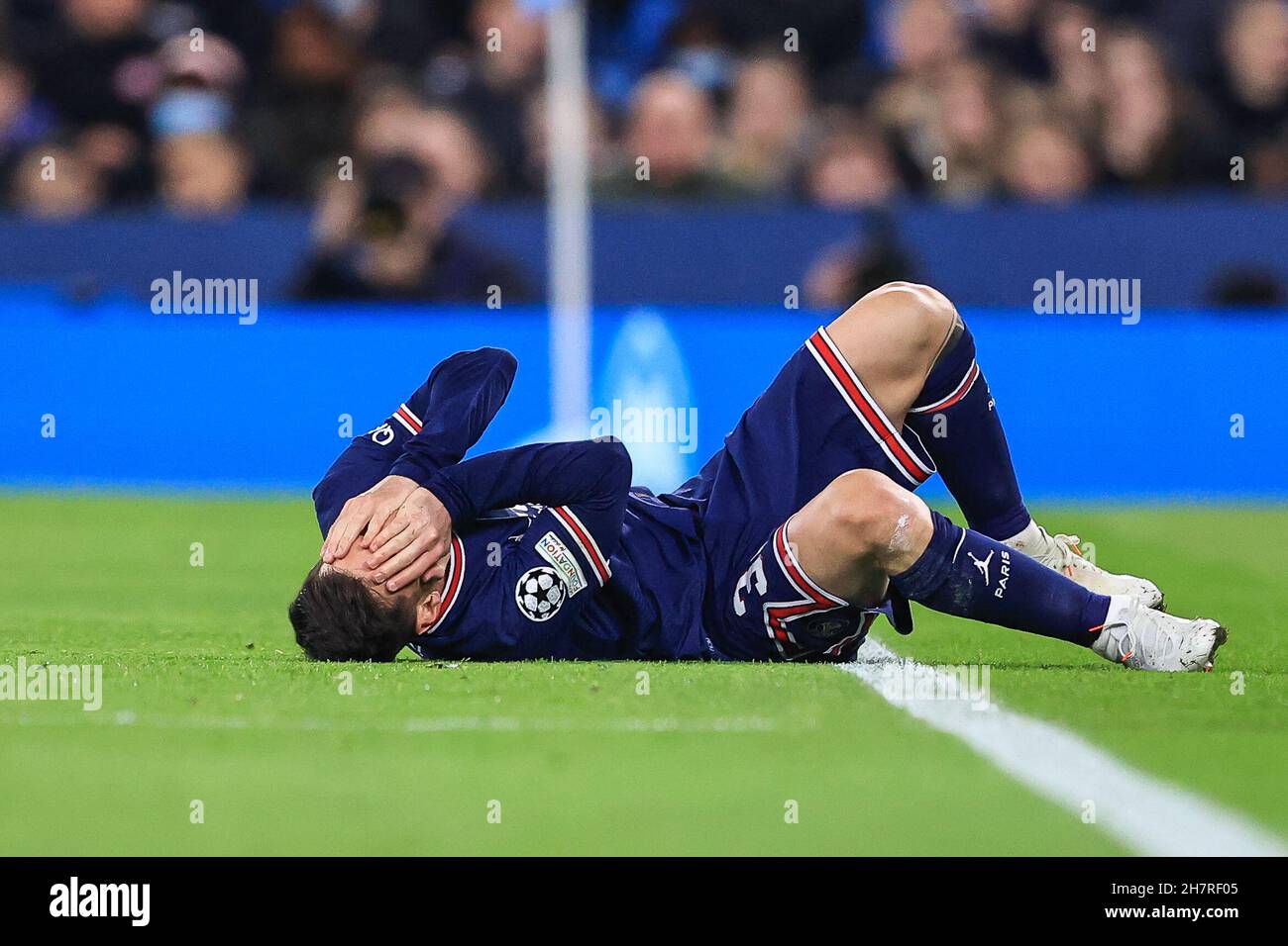 Lionel Messi #30 of Paris Saint-Germain on the floor in pain after a ...