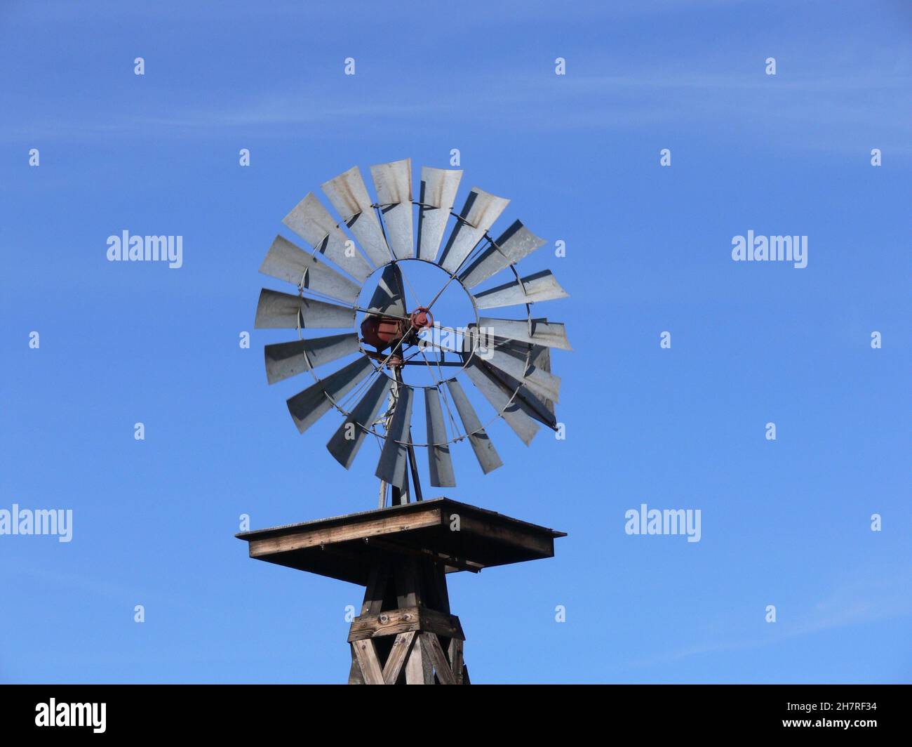 The top of a working windmill in the old west Stock Photo - Alamy