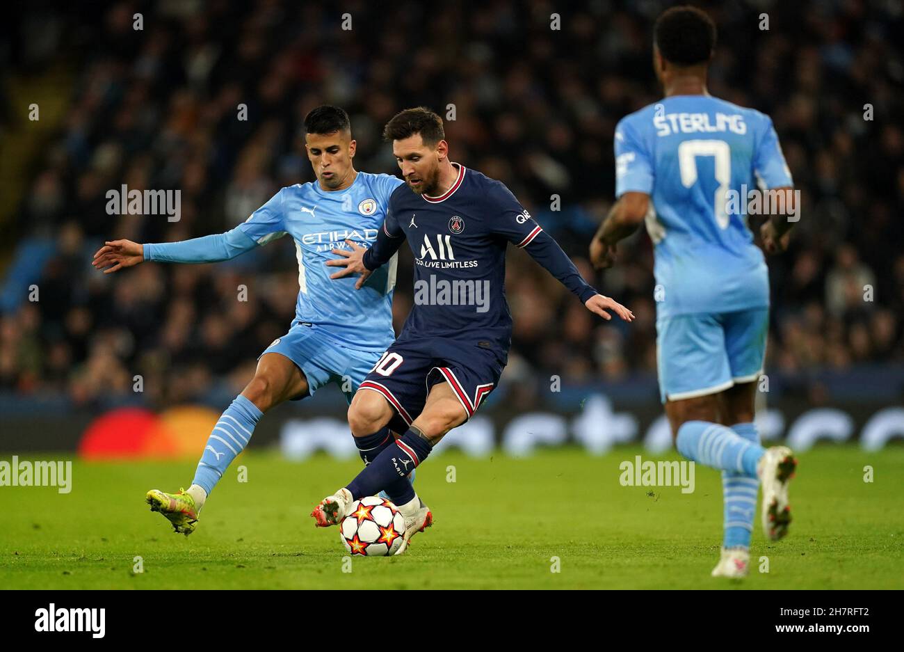 Manchester City's Joao Cancelo (left) and Paris Saint-Germain's Lionel ...