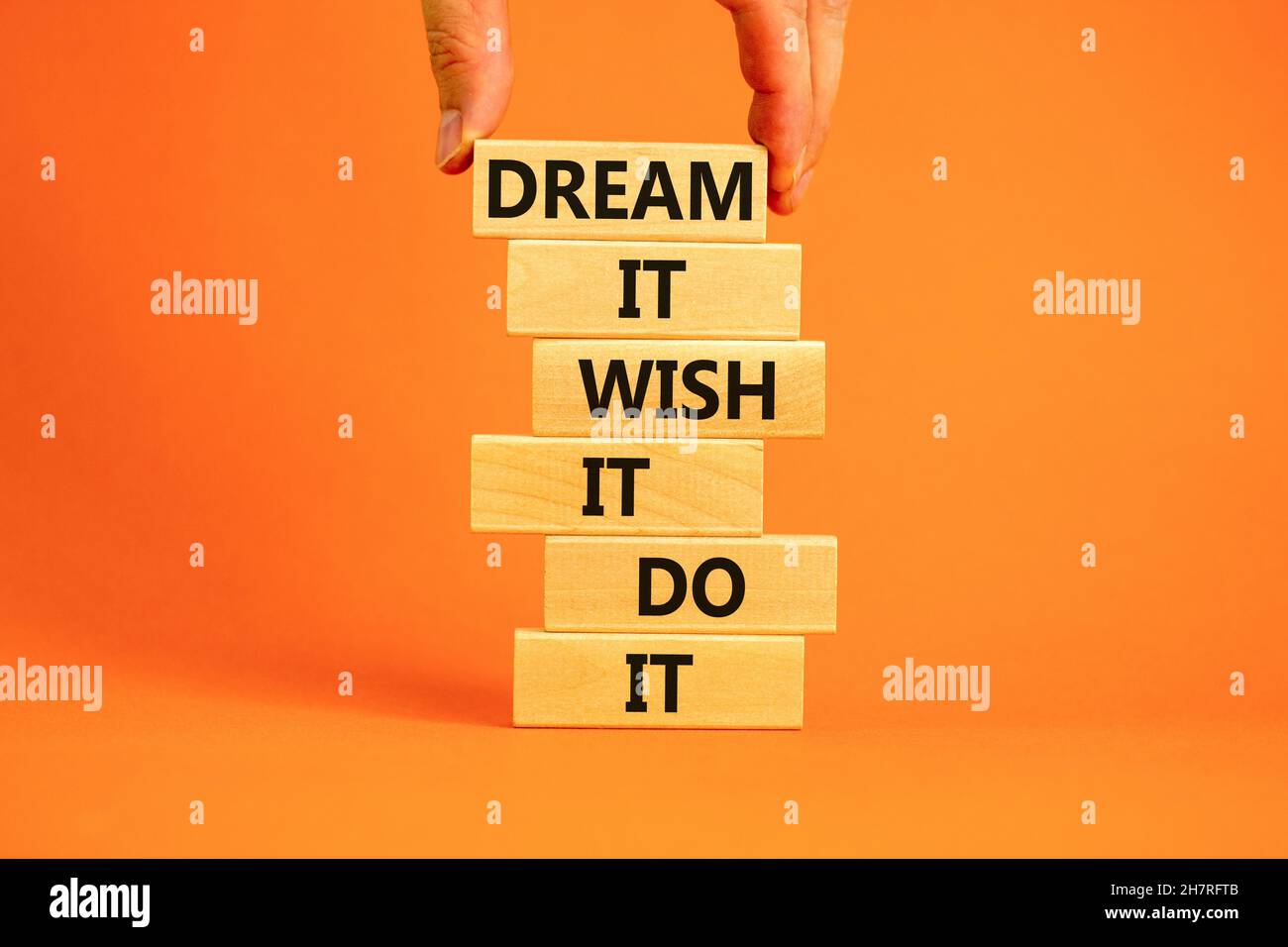 Dream wish and do it symbol. Wooden blocks with words Dream it, wish it ...