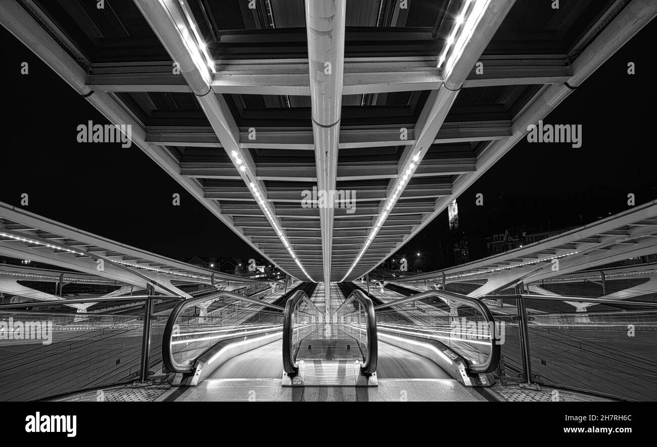 Grayscale shot of a train station interior with escalators Stock Photo ...