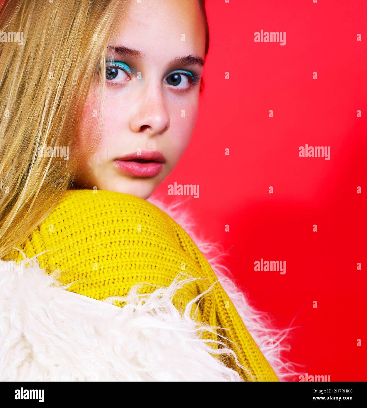 young pretty emitonal posing teenage girl on bright red background ...