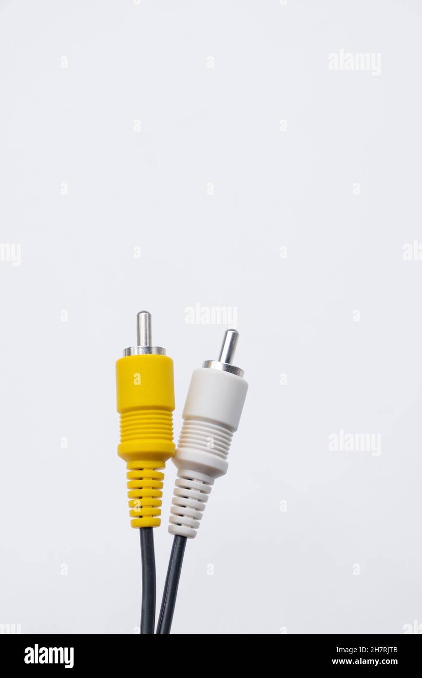Vertical shot of a yellow and white cable jack isolated on white ...