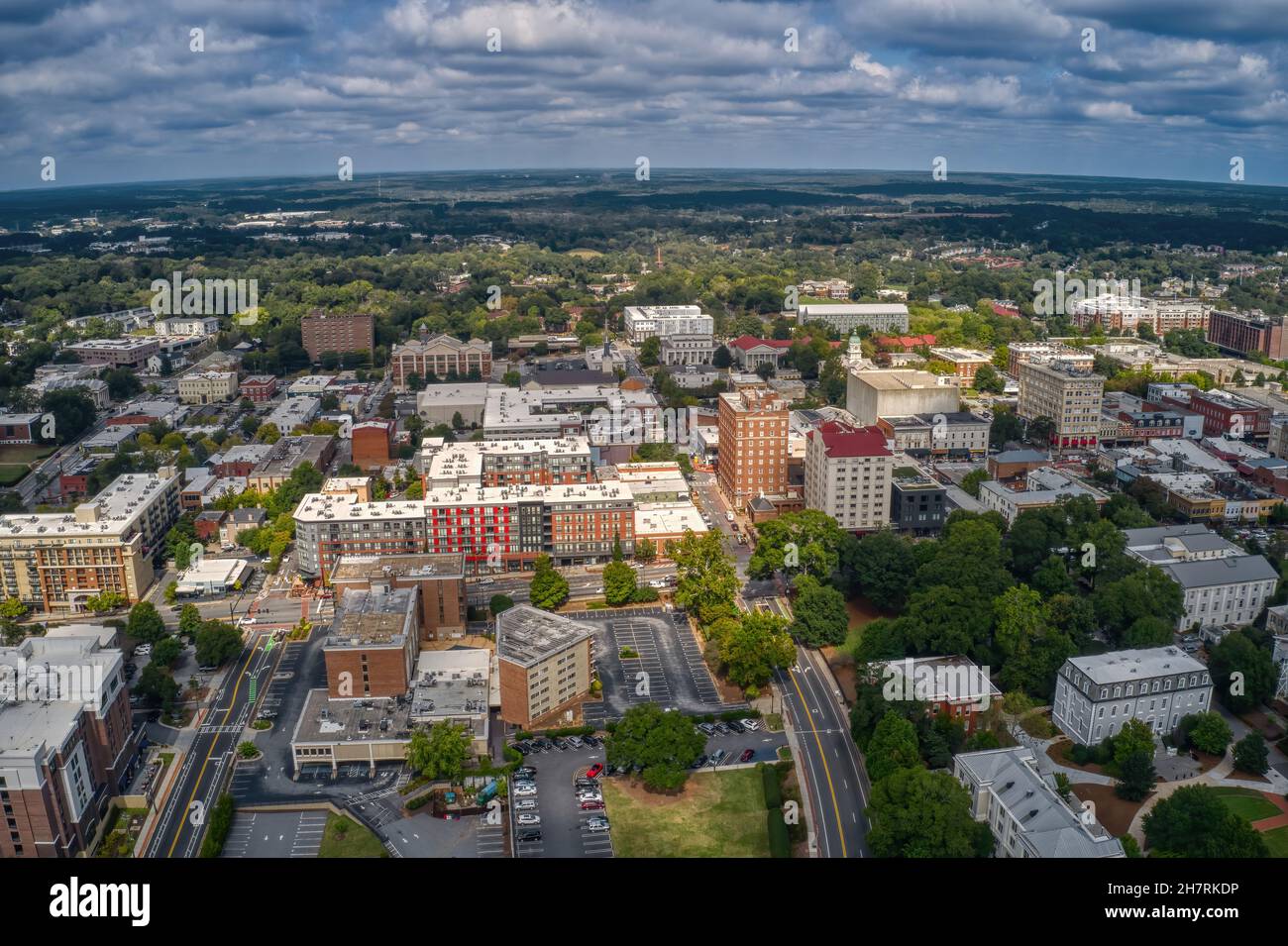 Beautiful aerial view of Athens with dense buildings under a cloudy sky ...