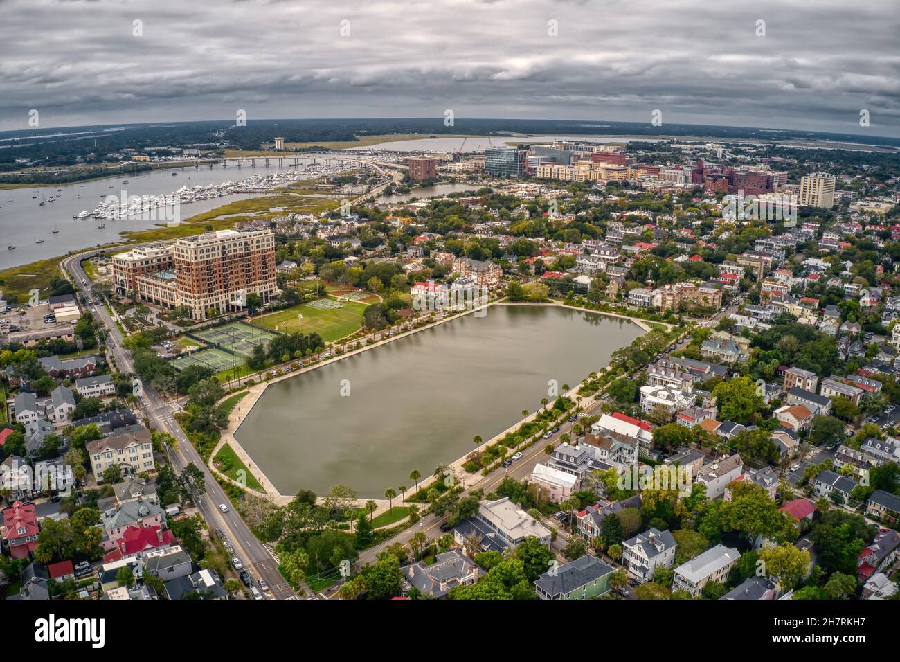 Aerial view of Charleston with dense buildings, a lake and a river in ...