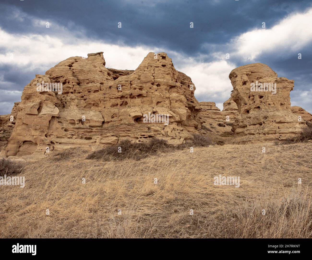 Landscape with a big rock and a cloudy sky Stock Photo - Alamy