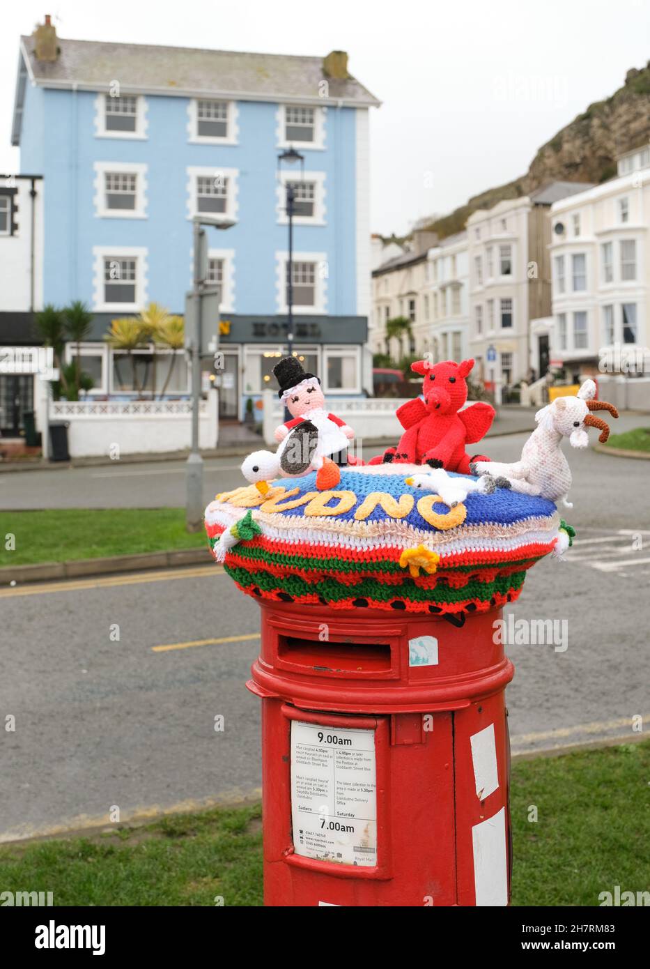 A red post box close to Llandudno pier with an amusing decoration of ...