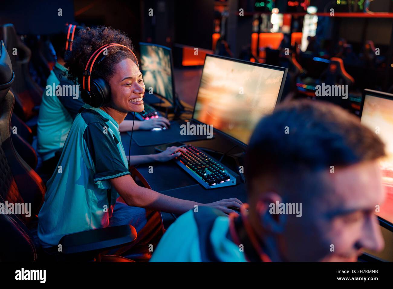 Young gamers participating in esports tournament in gaming club Stock ...