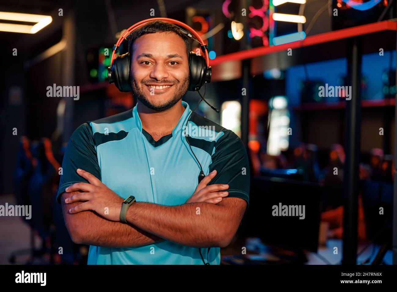 Handsome gamer satisfied with game in computer club Stock Photo - Alamy