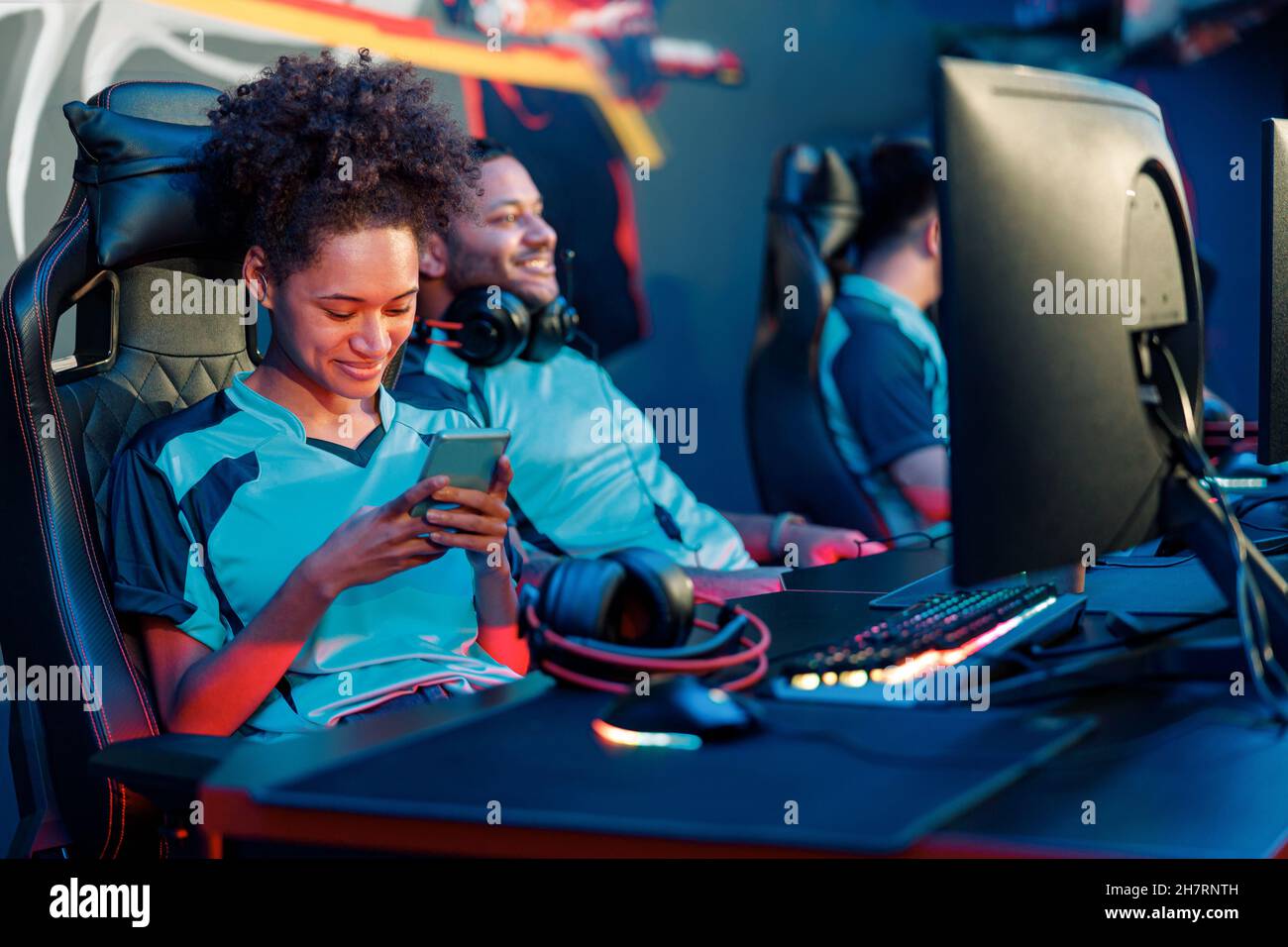 Cybersport gamer playing mobile game on cellphone in cyber club Stock ...