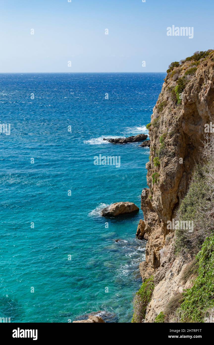 Crystal blue sea water next to cliff at Chania Crete Stock Photo - Alamy