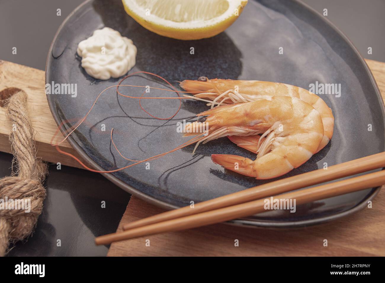 Roasted tails of shrimps with fresh rosemary and lemon Stock Photo - Alamy