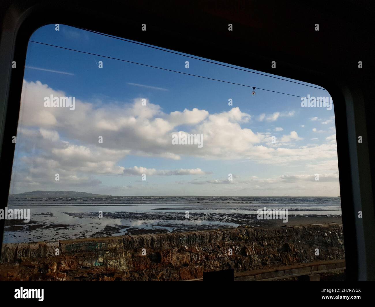 DUBLIN, IRELAND - Nov 08, 2019: Seascape seen through the window of a ...