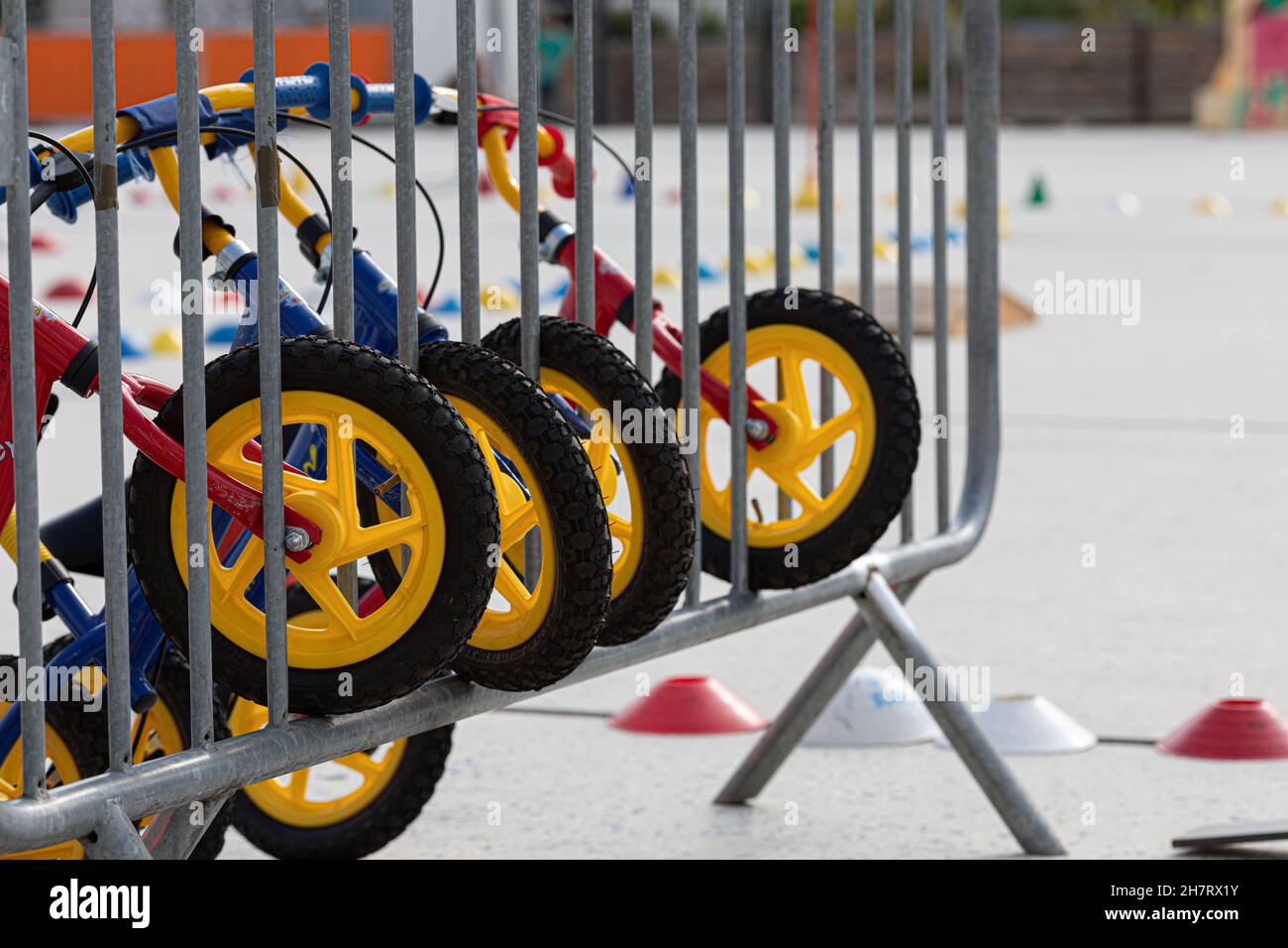 Bicycle parking rack with small, colorful bicycles for children Stock ...