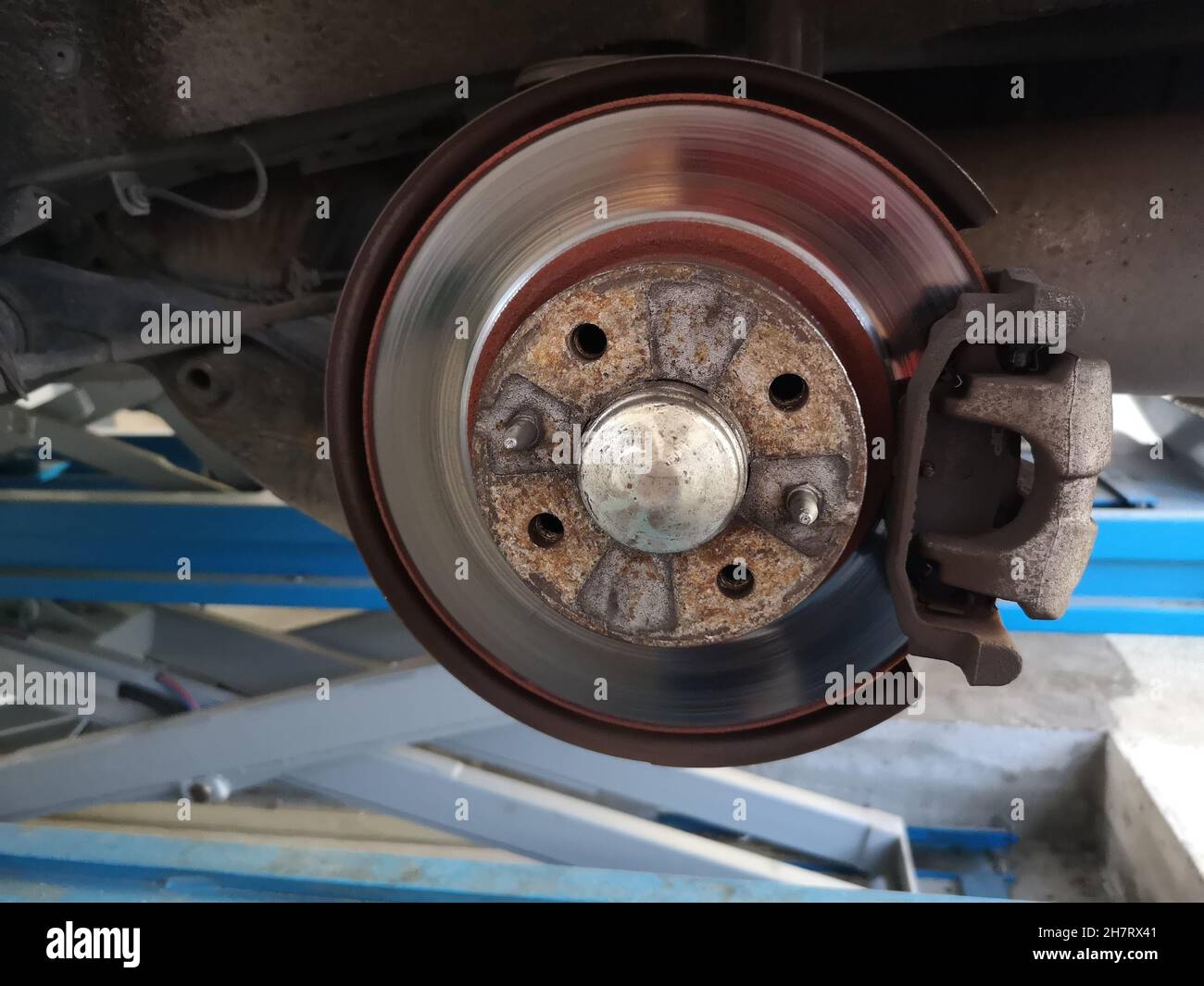 Shiny disc brake of a car in a garage Stock Photo - Alamy