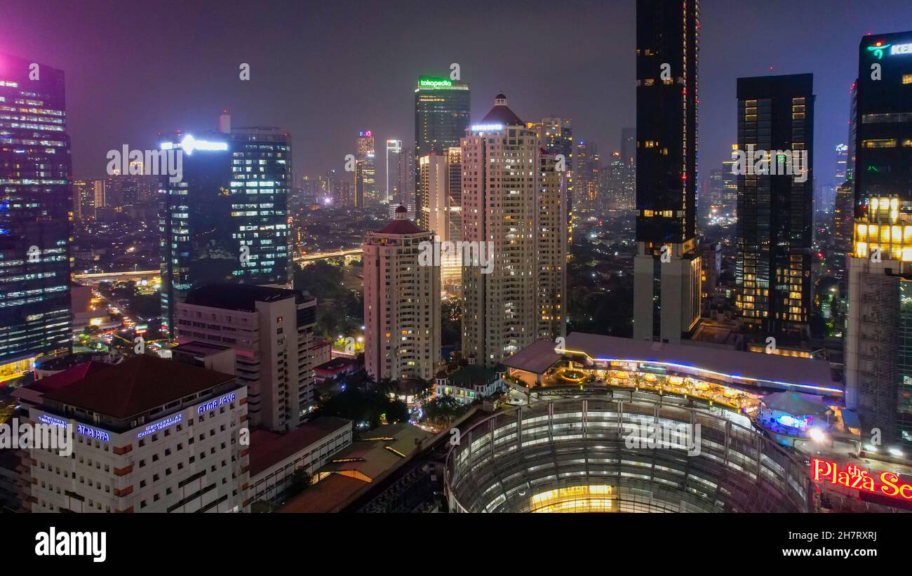 Aerial view on highways and skyscrapers. Spectacular nighttime skyline ...