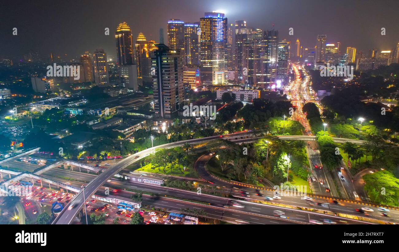 Aerial view on highways and skyscrapers. Spectacular nighttime skyline ...