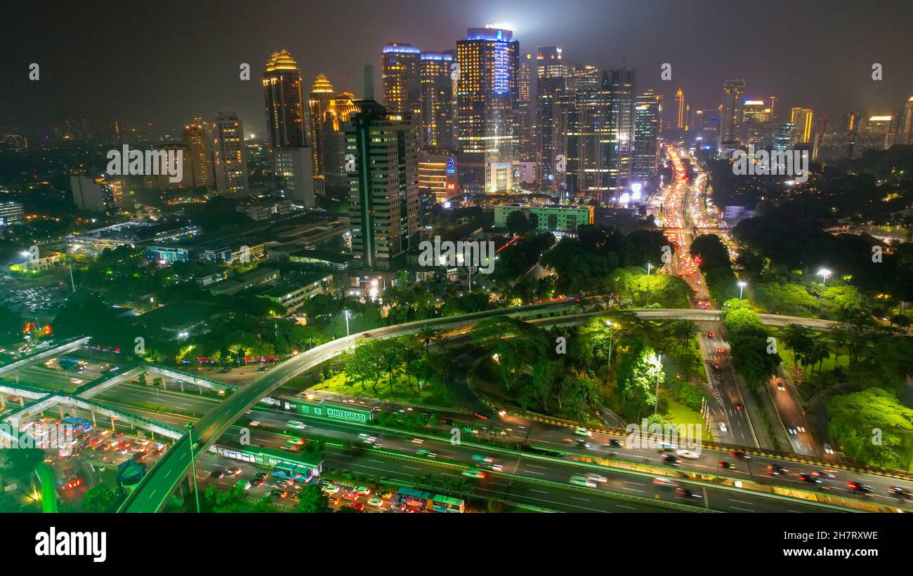 Aerial view on highways and skyscrapers. Spectacular nighttime skyline ...