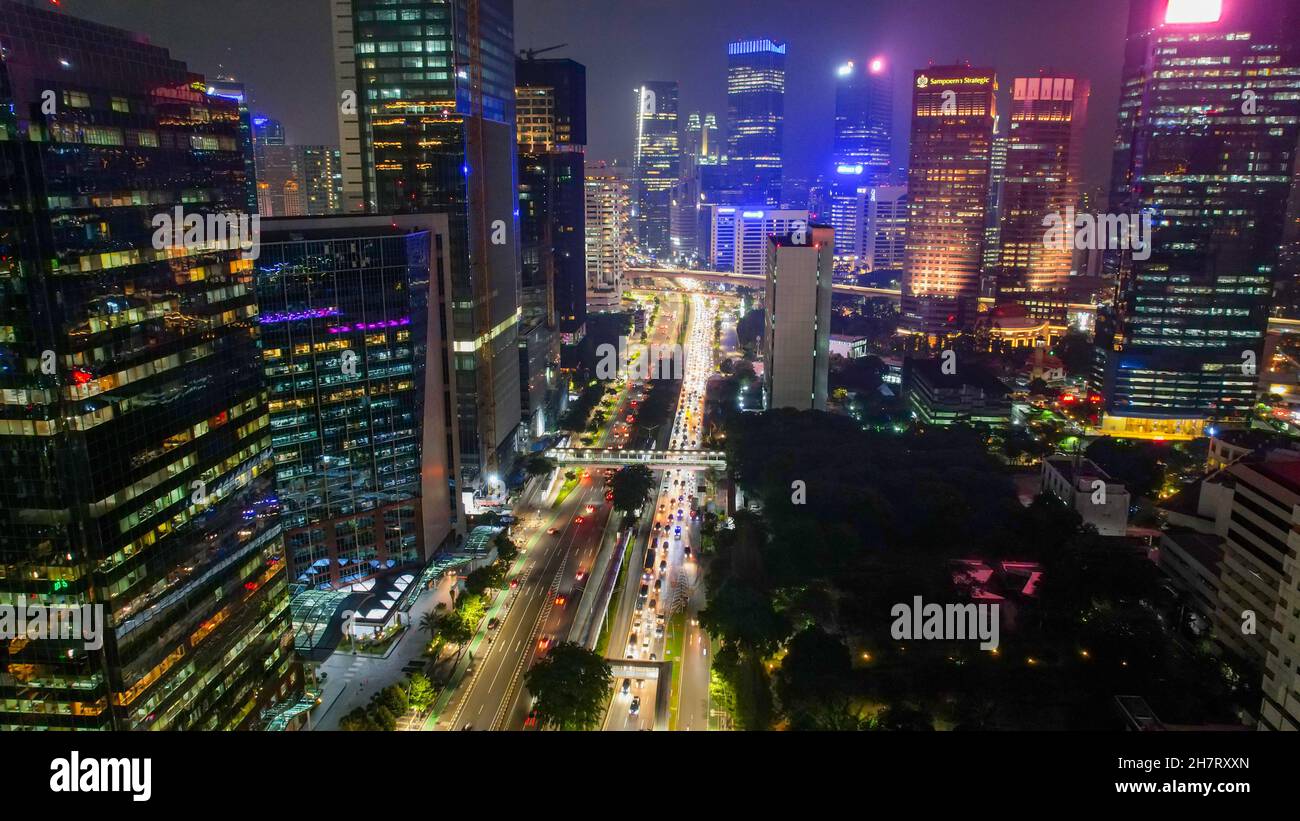 Aerial view on highways and skyscrapers. Spectacular nighttime skyline ...