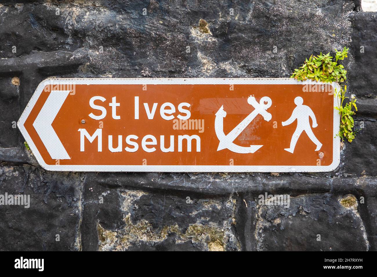 A sign showing visitors the direction of the St. Ives Museum, in the ...