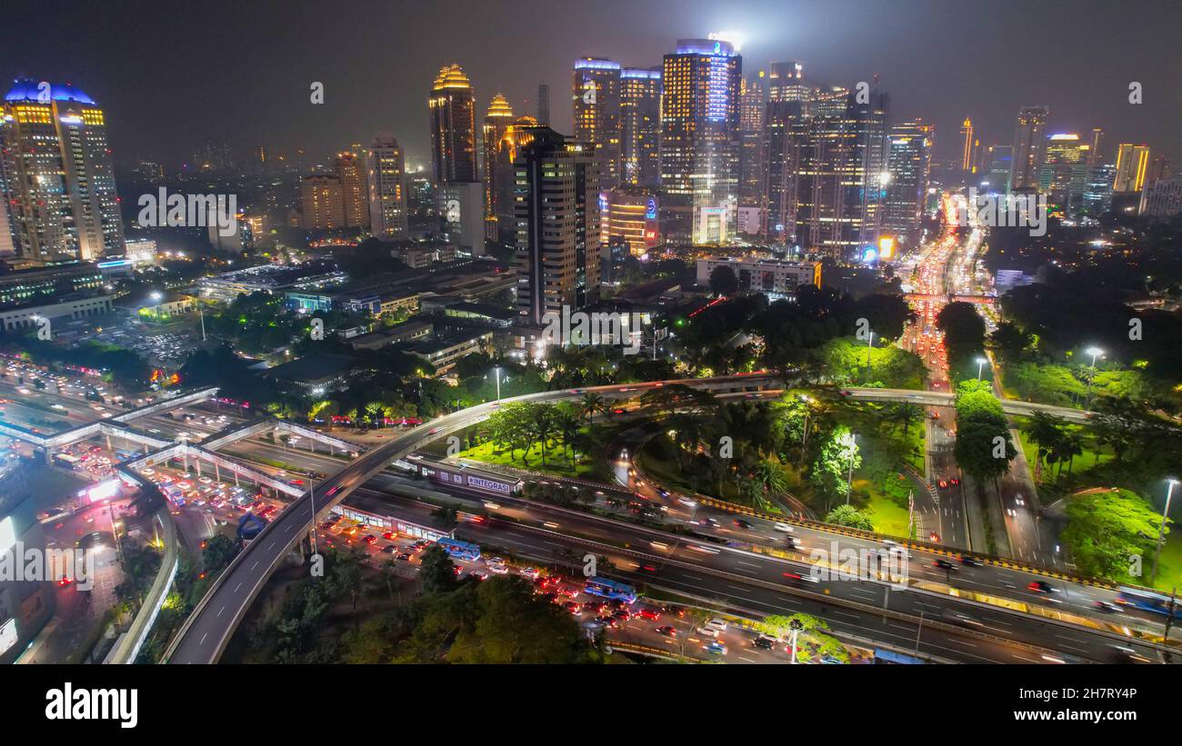 Aerial view on highways and skyscrapers. Spectacular nighttime skyline ...