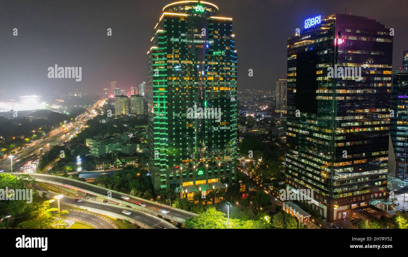 Aerial view on highways and skyscrapers. Spectacular nighttime skyline ...