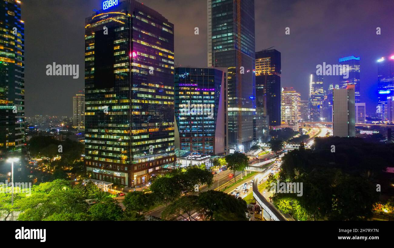 Aerial view on highways and skyscrapers. Spectacular nighttime skyline ...