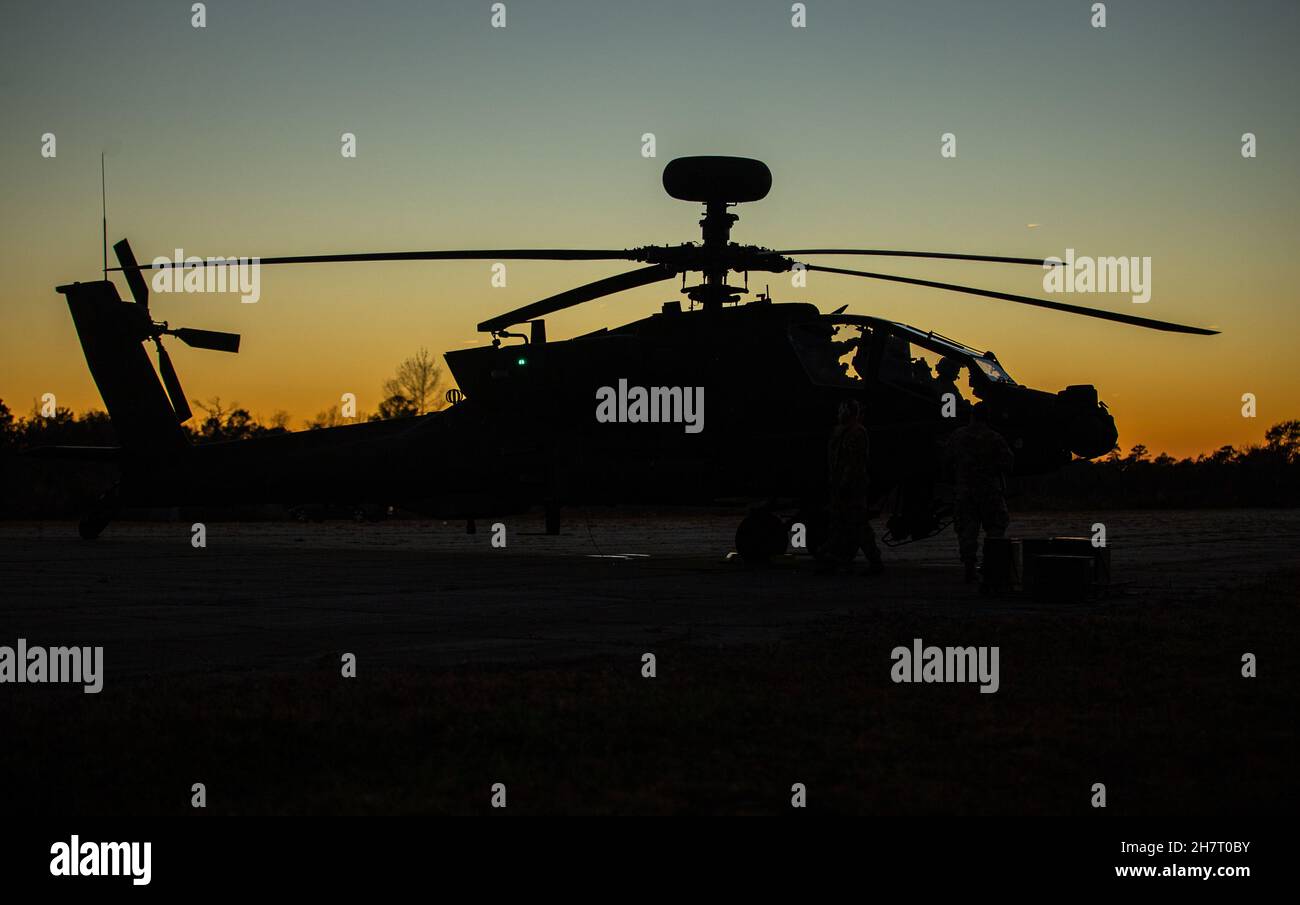 U.S. Army pilots prepare to disembark their AH-64E Apache helicopter ...