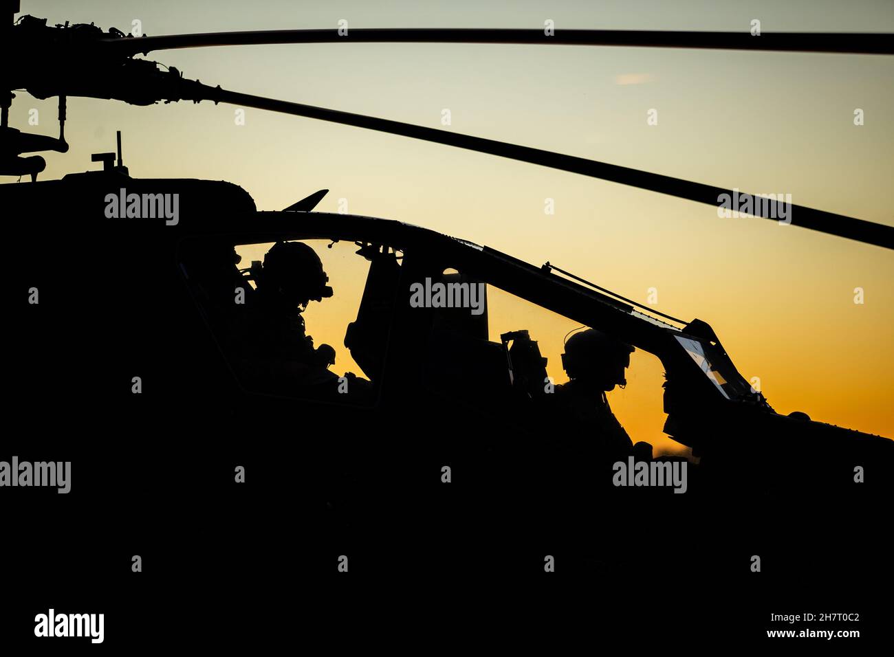 U.S. Army pilots prepare to disembark their AH-64E Apache helicopter ...