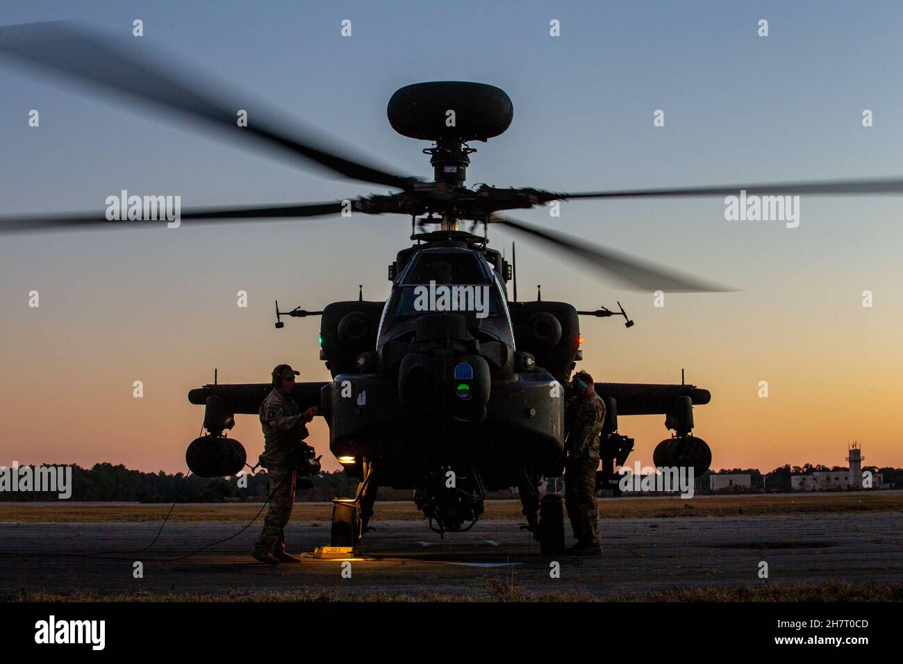 U.S. Army Soldiers perform post flight maintenance on an AH-64E Apache ...