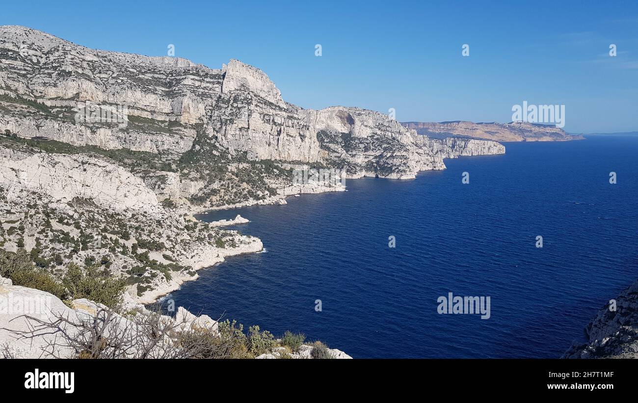 Beautiful landscape view of a blue beach and cliffs Stock Photo - Alamy