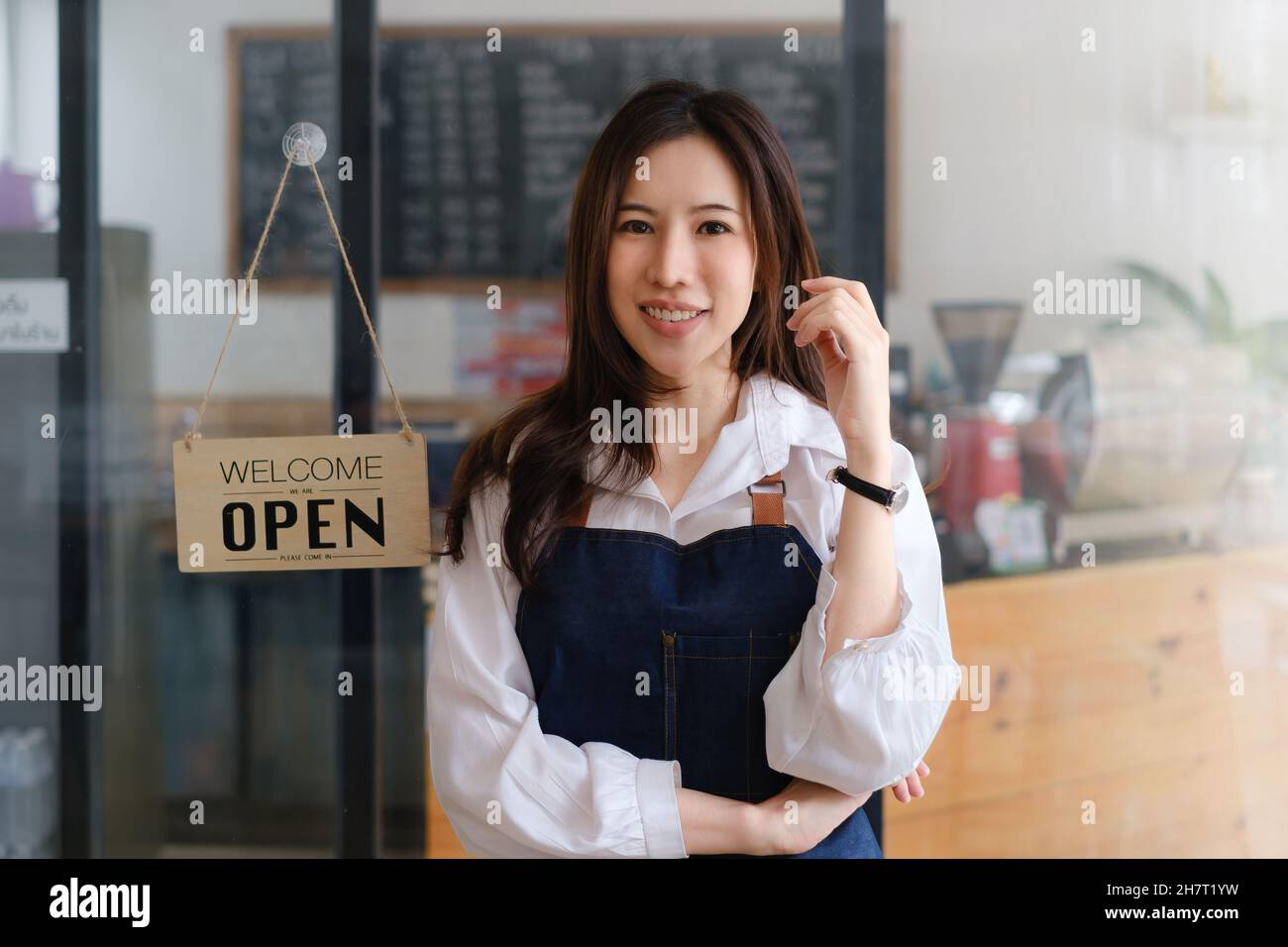 Asian coffee shop owner in coffee shop. Small business owner and ...