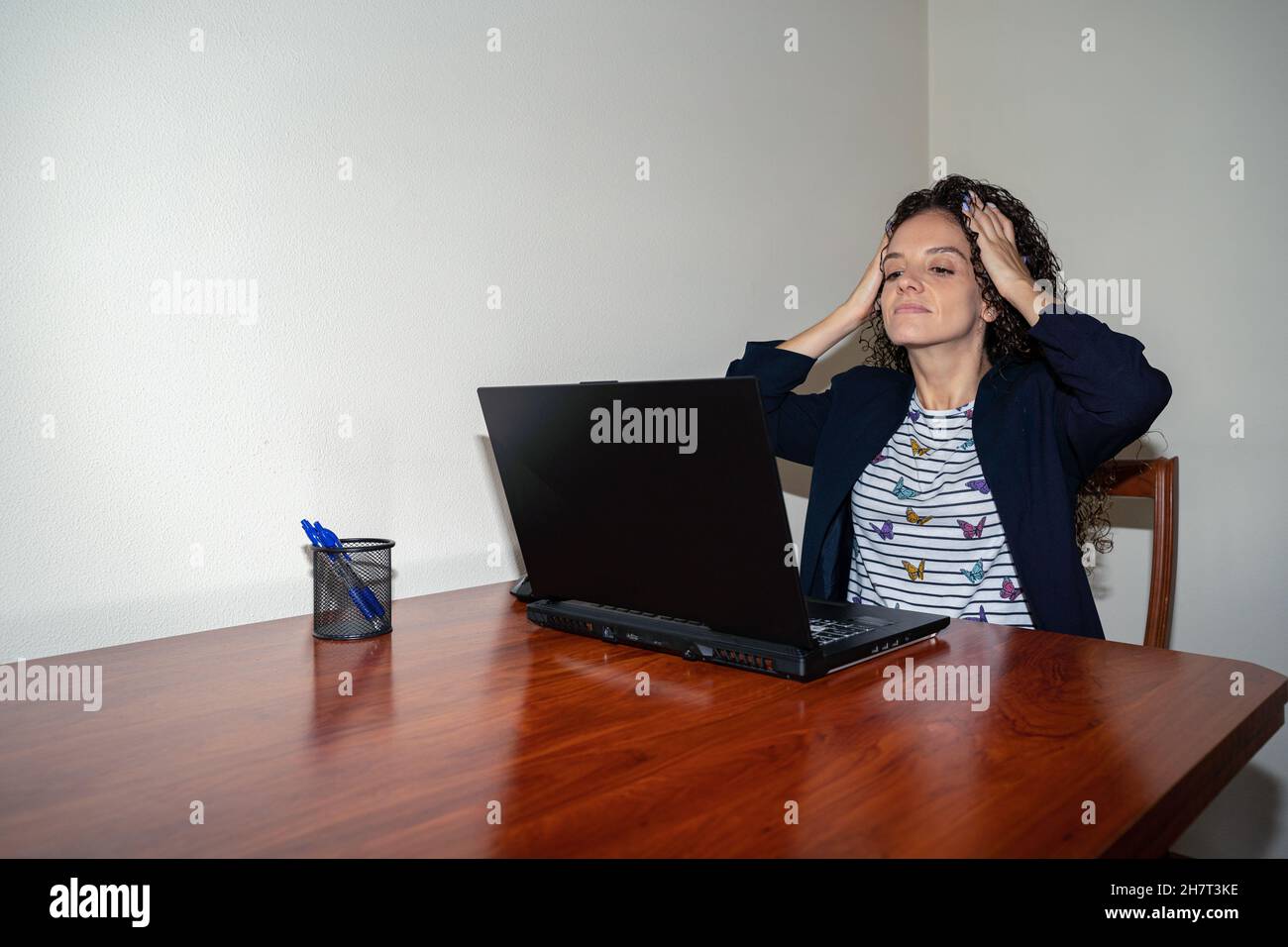 stressed young woman working Stock Photo - Alamy
